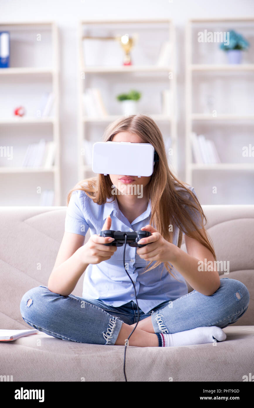 Young girl playing virtual reality games Stock Photo - Alamy