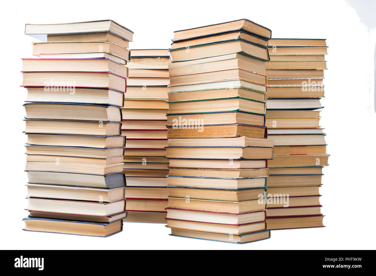 Stack of artistic old books stacked and isolated on white background ...