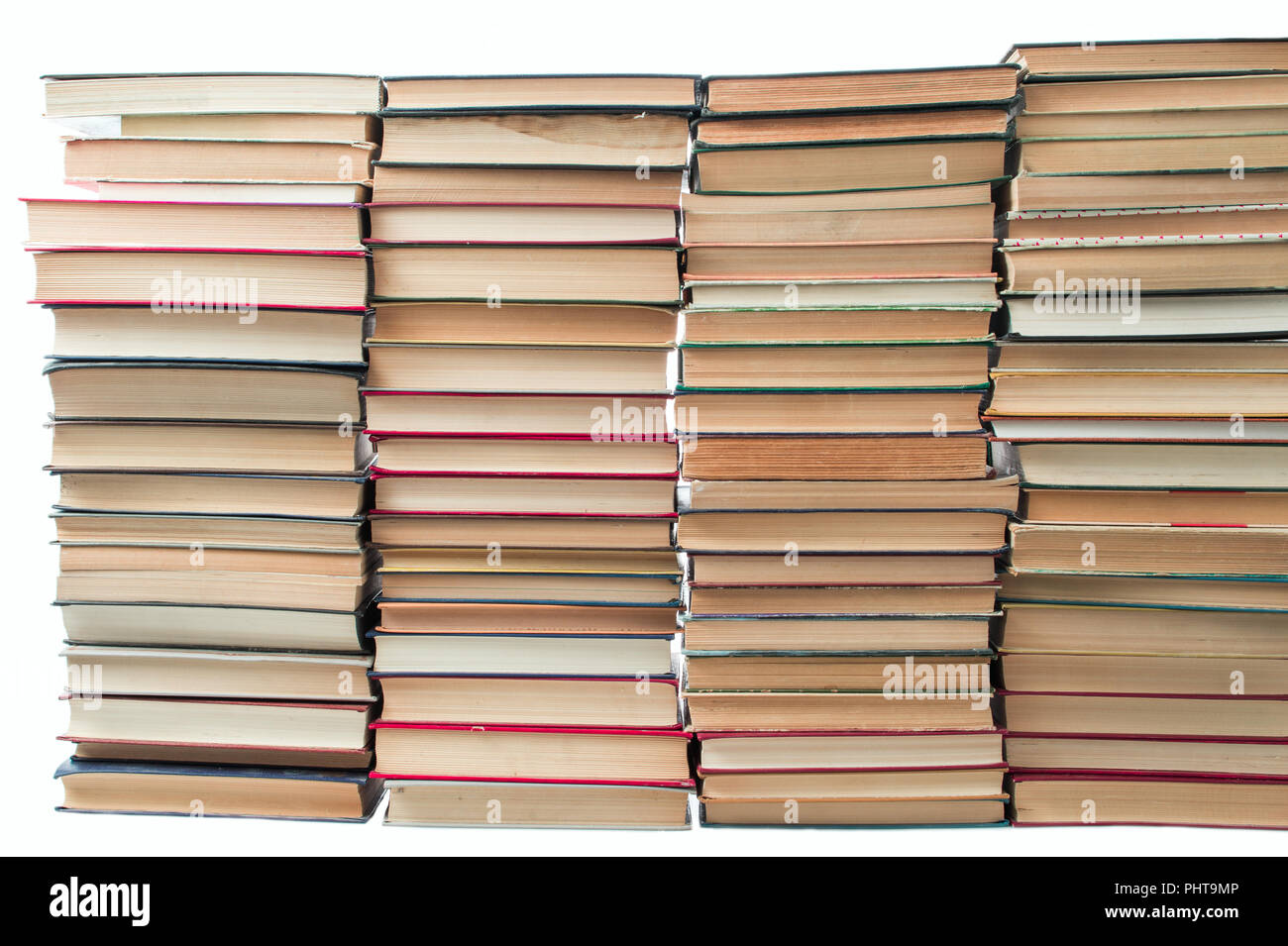Stack of artistic old books stacked and isolated on white background ...