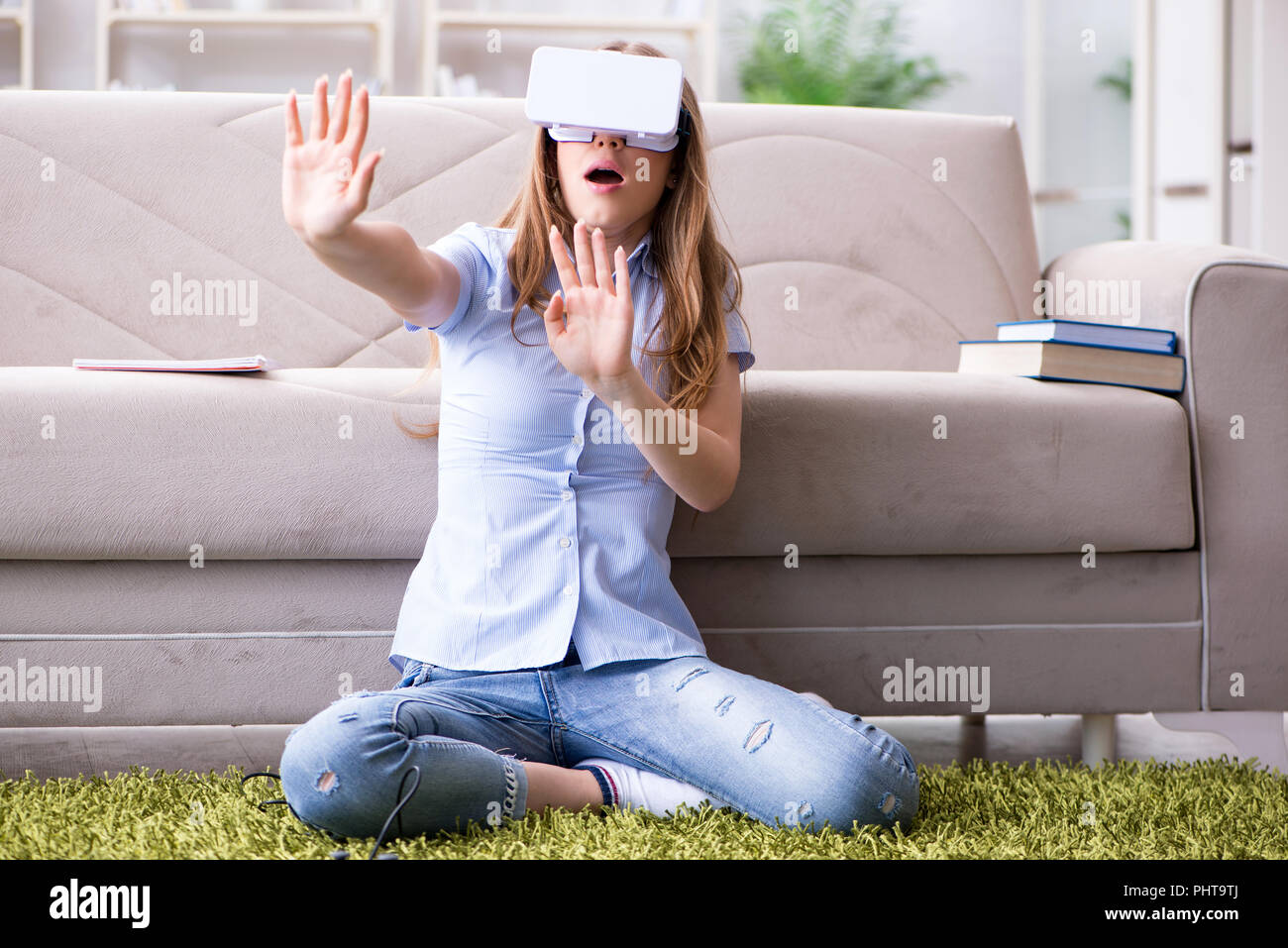 Young girl playing virtual reality games Stock Photo - Alamy