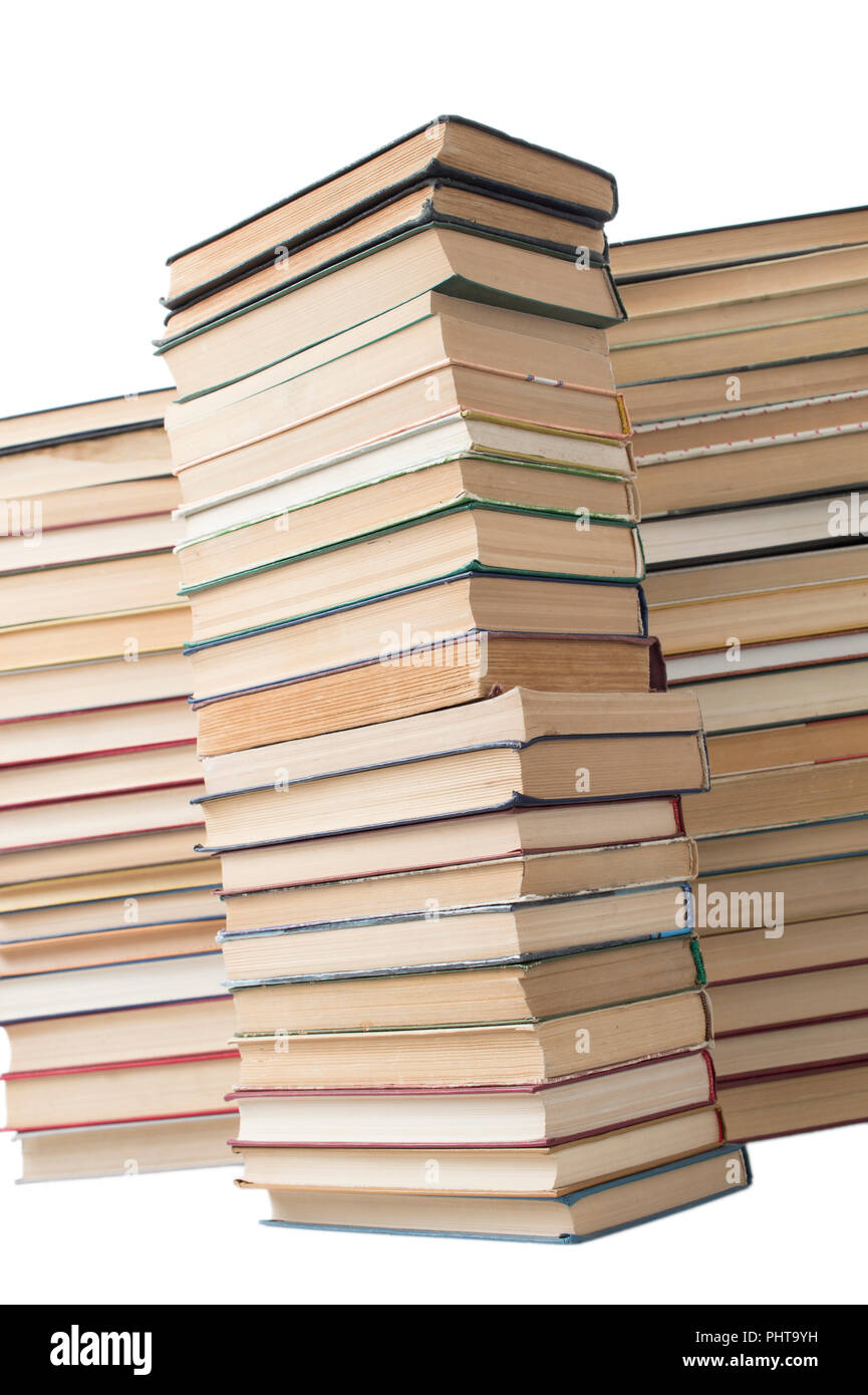Stack of artistic old books stacked and isolated on white background ...