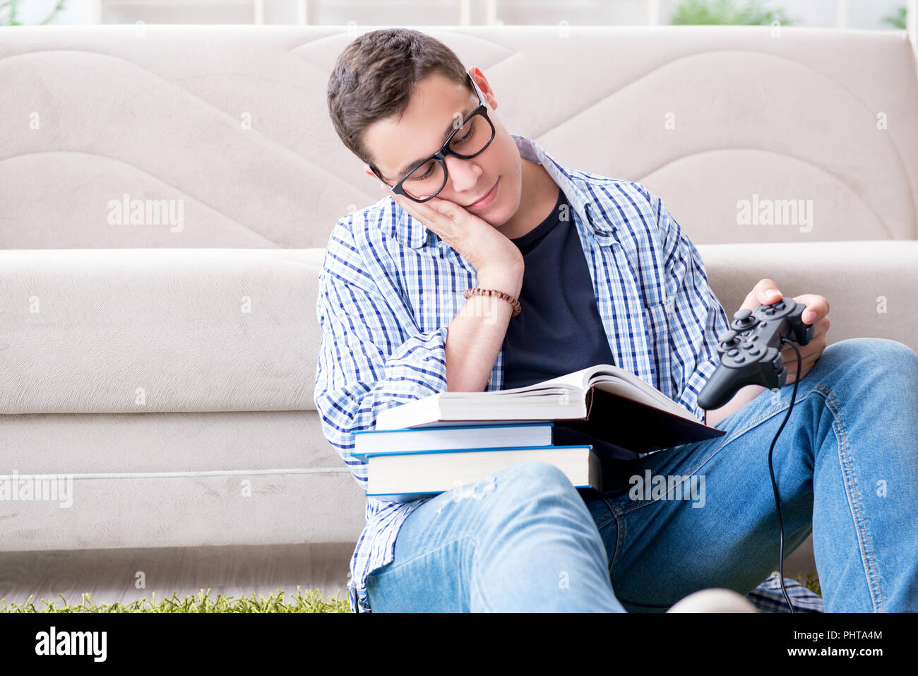 Boy trying to balance books hi-res stock photography and images - Alamy