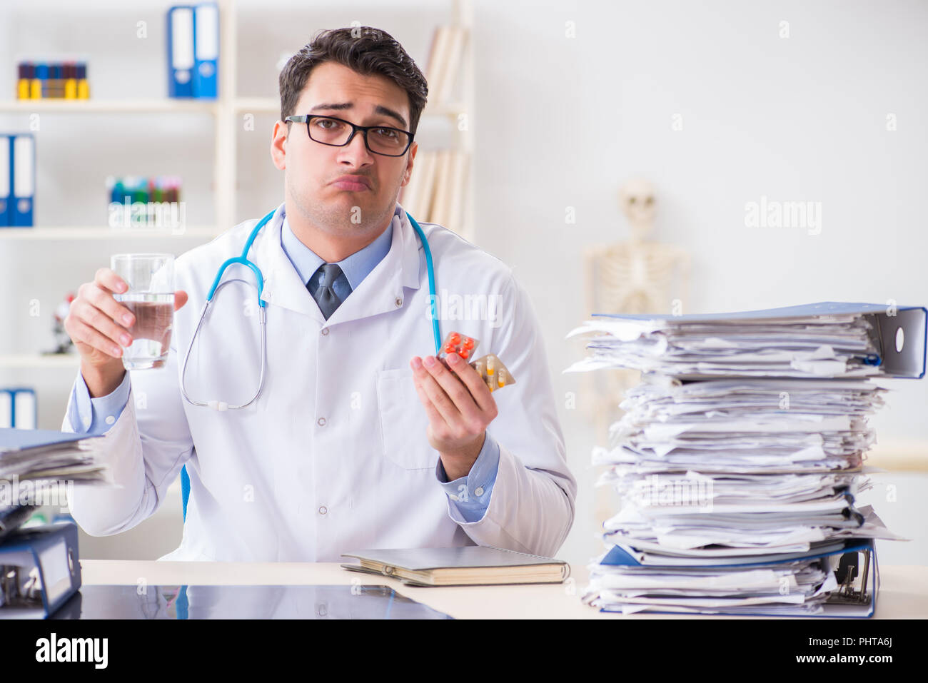 Busy doctor with too much work in hospital Stock Photo - Alamy