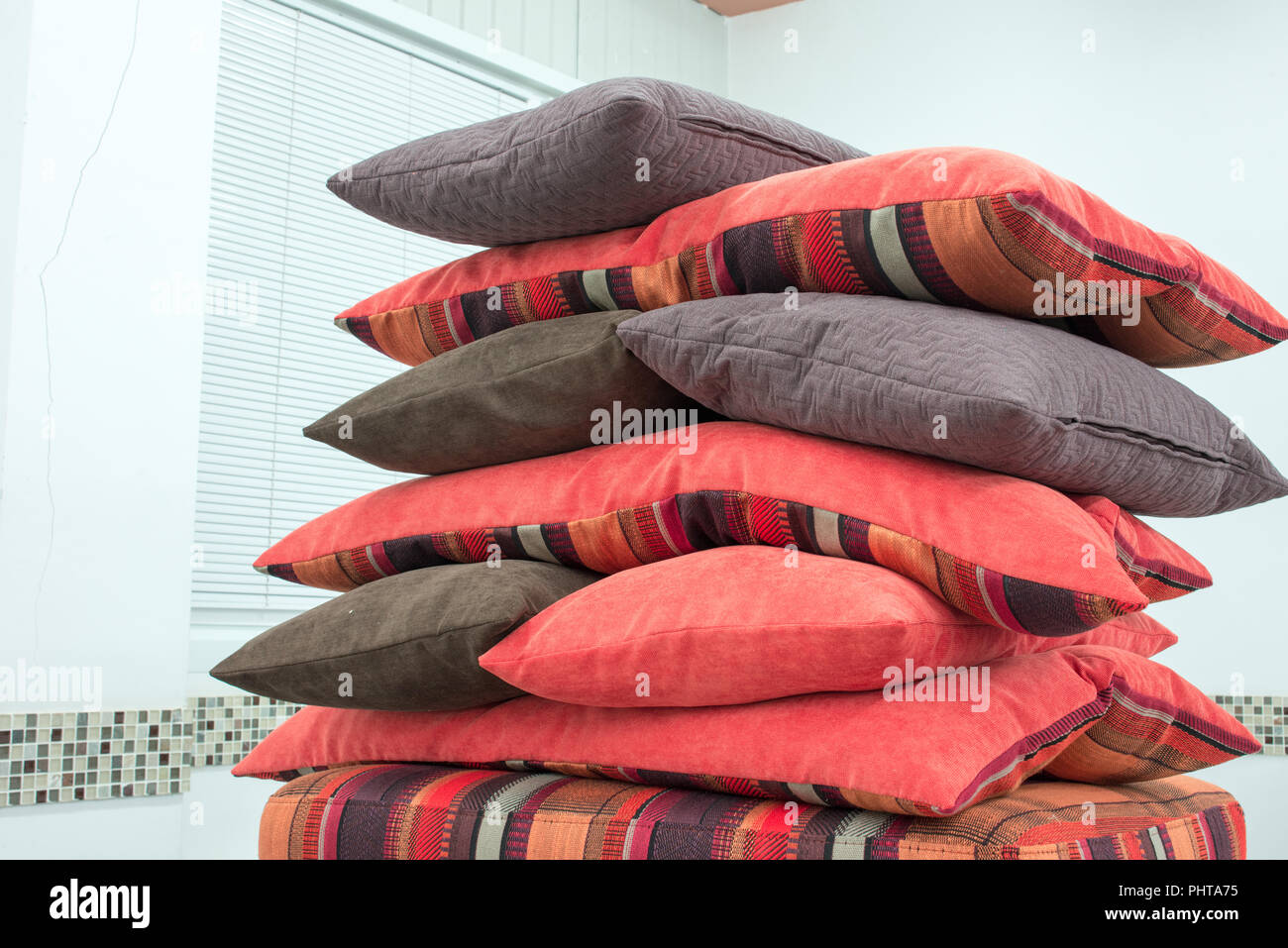 bright colored cushions of fabric folded on each other Stock Photo - Alamy