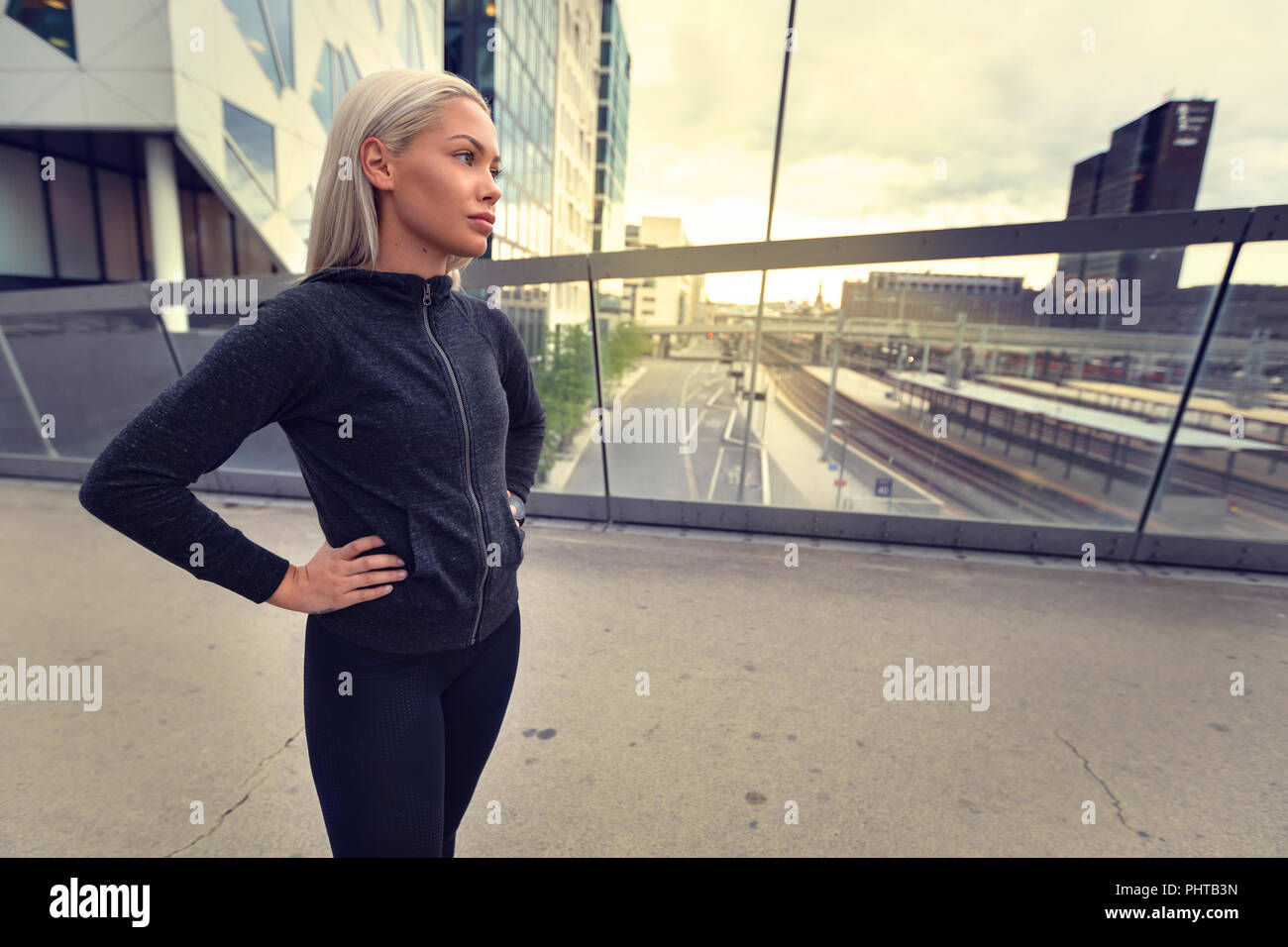 Female Jogger Resting With Hands On Hips After Workout at Sunset Stock ...