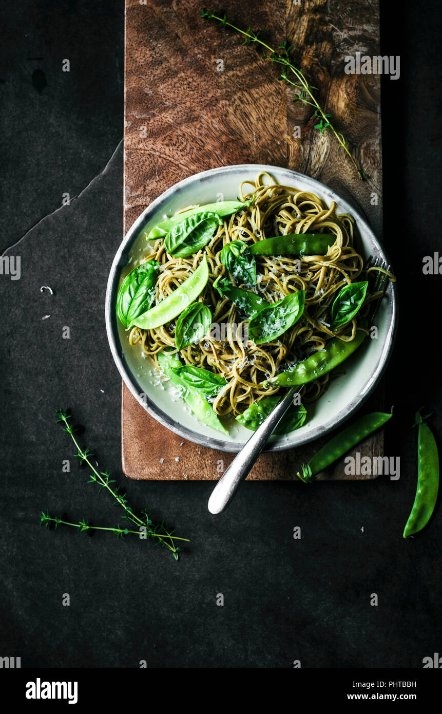 Gluten free spaghetti with snap peas, basil, and thyme Stock Photo - Alamy