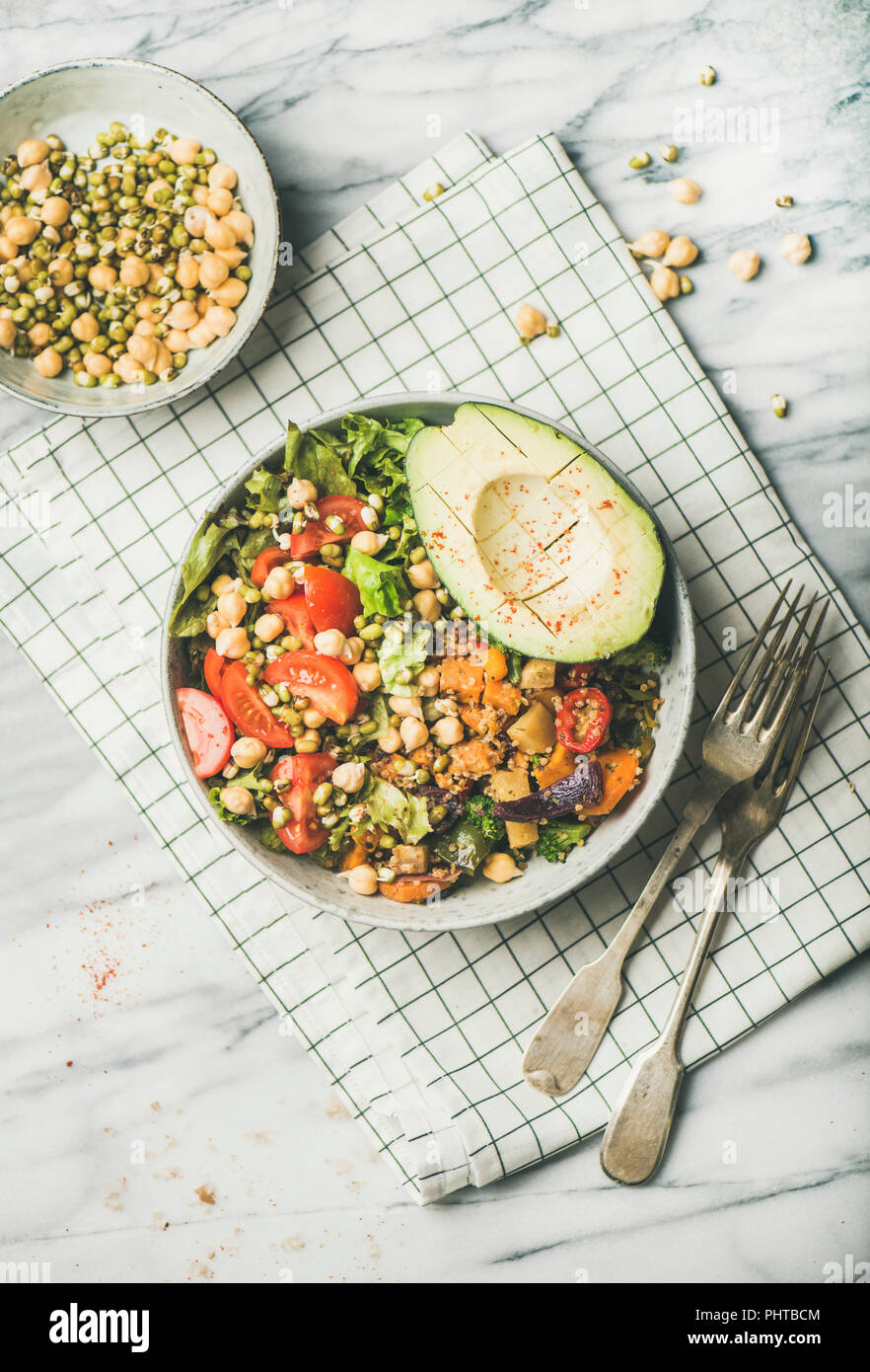 Vegan lunch bowl. Flat-lay of vegan dinner with avocado, mixed grains ...