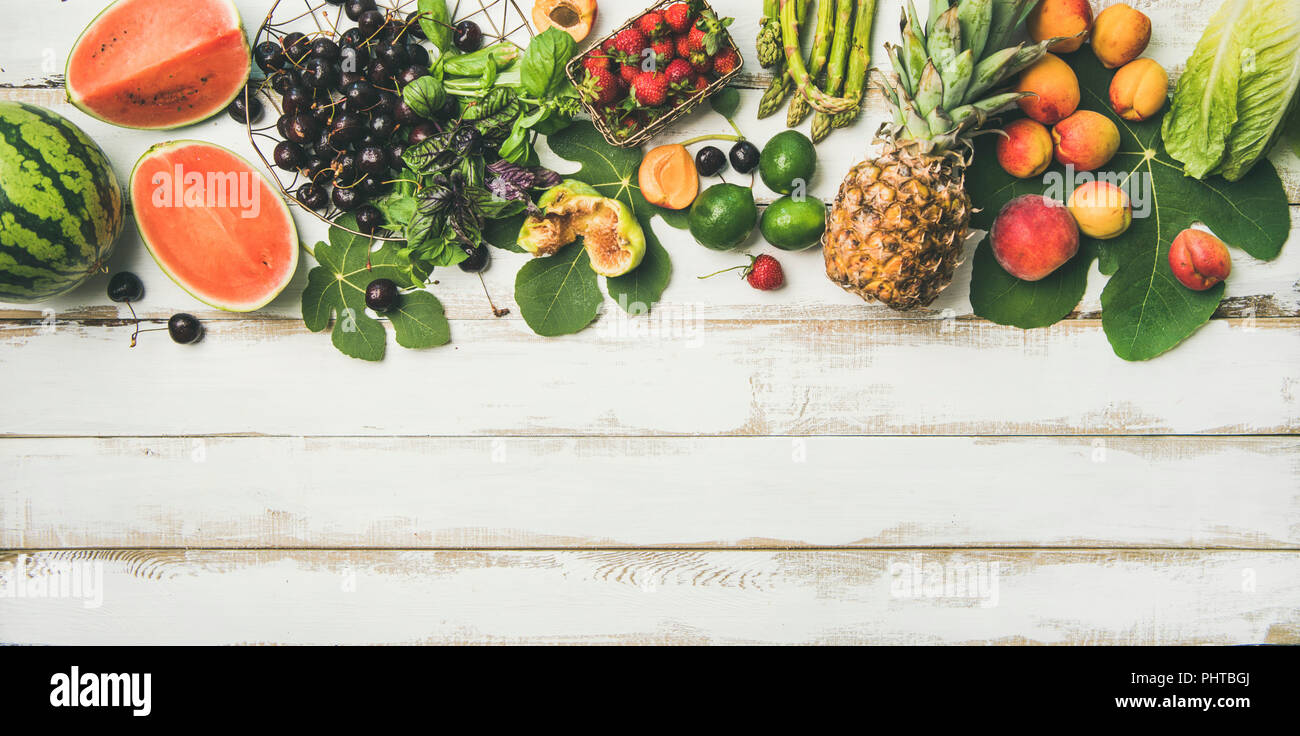Summer food background. Flat-lay of seasonal fruit, vegetables and ...