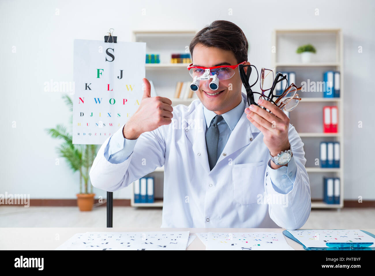 Eye doctor in eyecare concept in hospital Stock Photo - Alamy