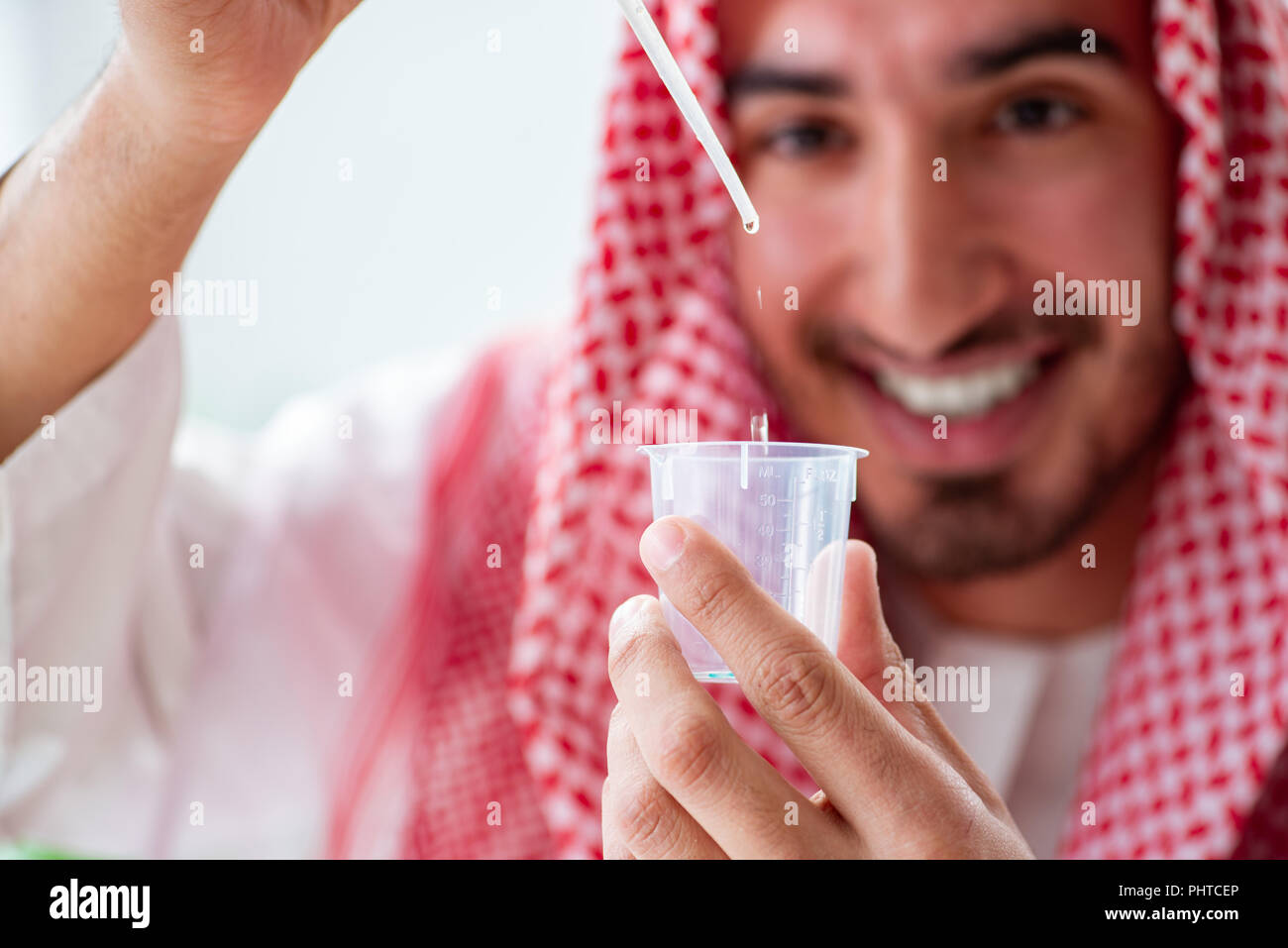Arab chemist checking the quality of drinking water Stock Photo - Alamy