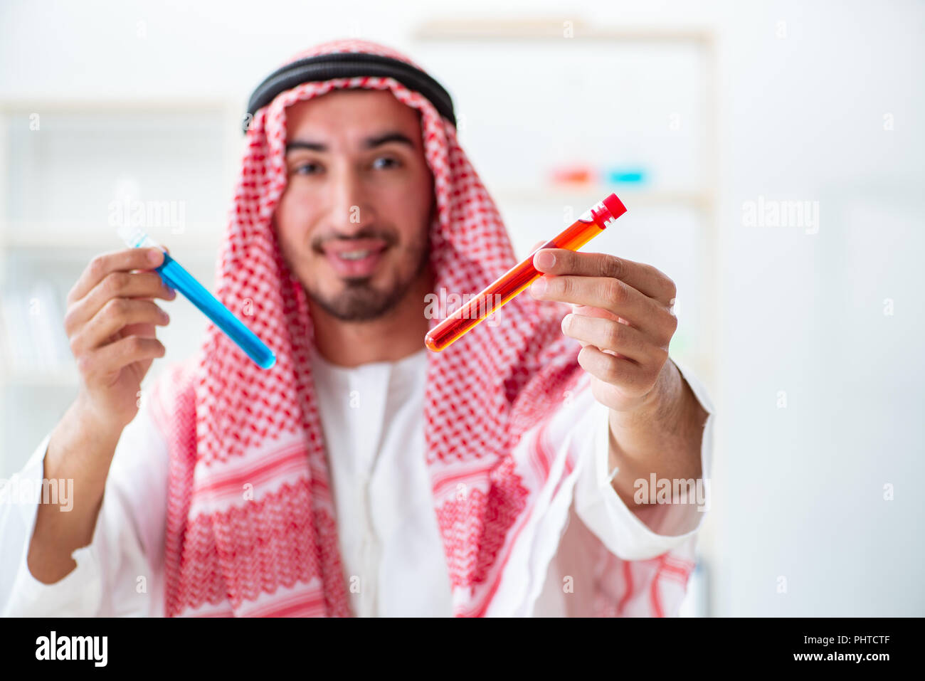 Arab chemist working in the lab office Stock Photo - Alamy
