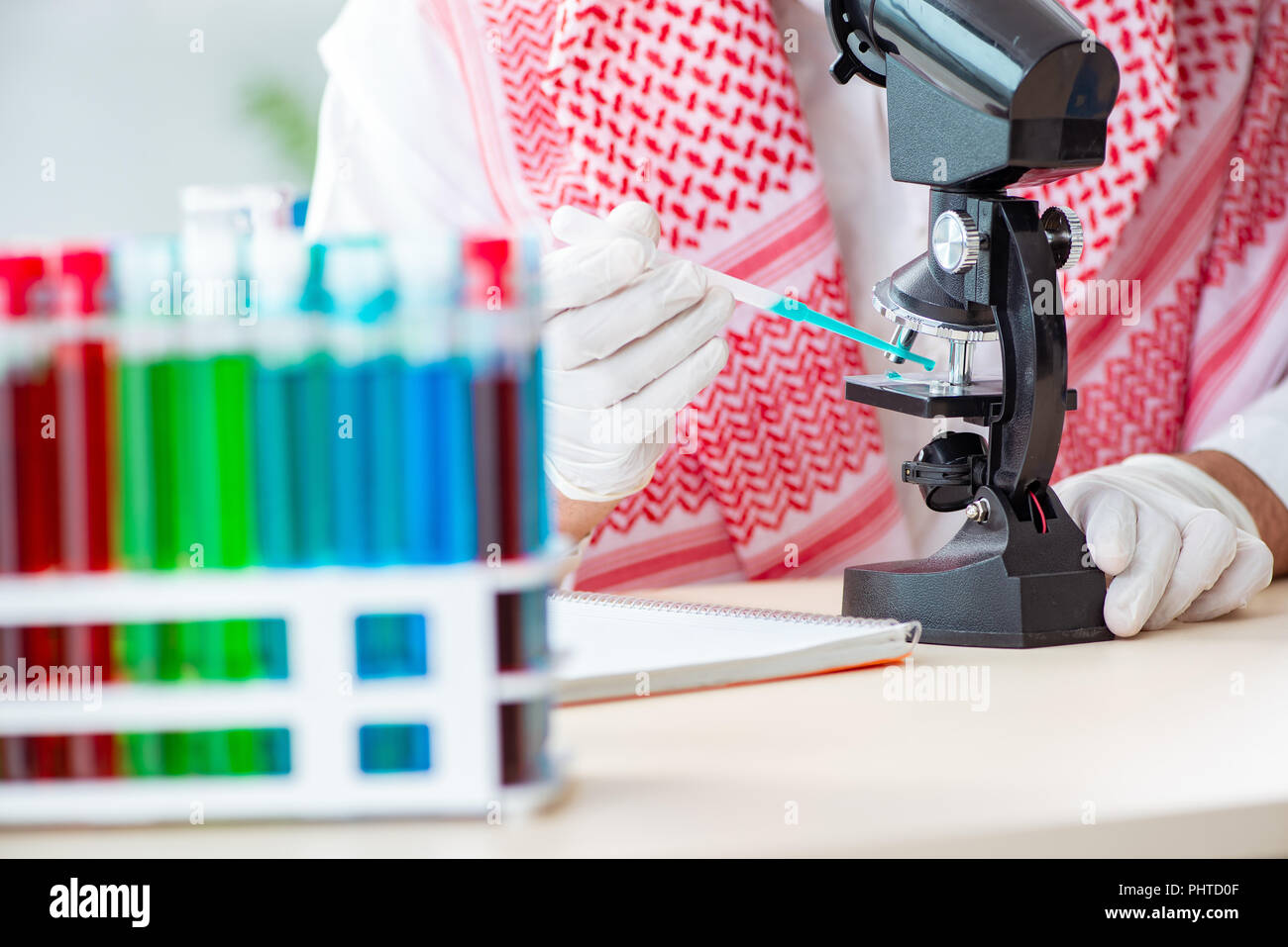 Arab chemist working in the lab office Stock Photo - Alamy