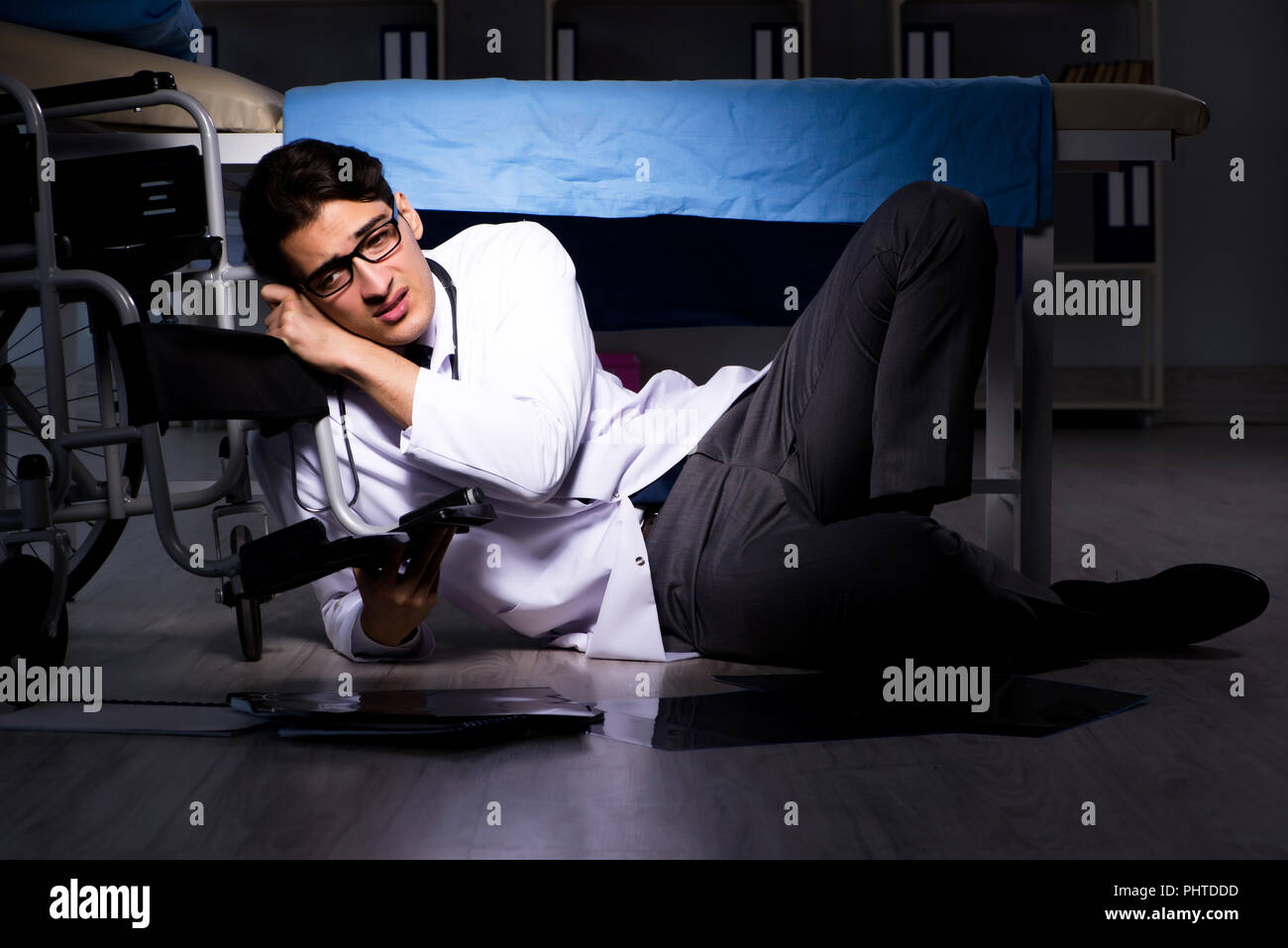 Doctor working night shift in hospital after long hours Stock Photo - Alamy