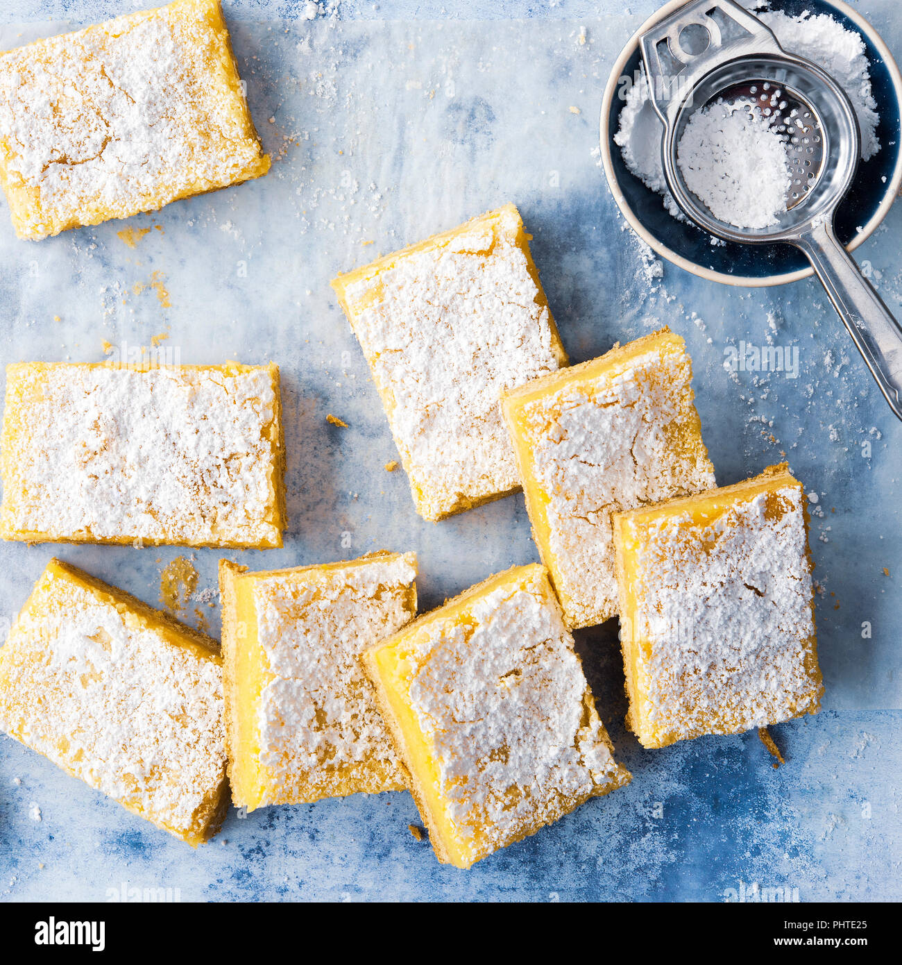 Pieces of homemade lemon slice with icing sugar in a sifter Stock Photo ...