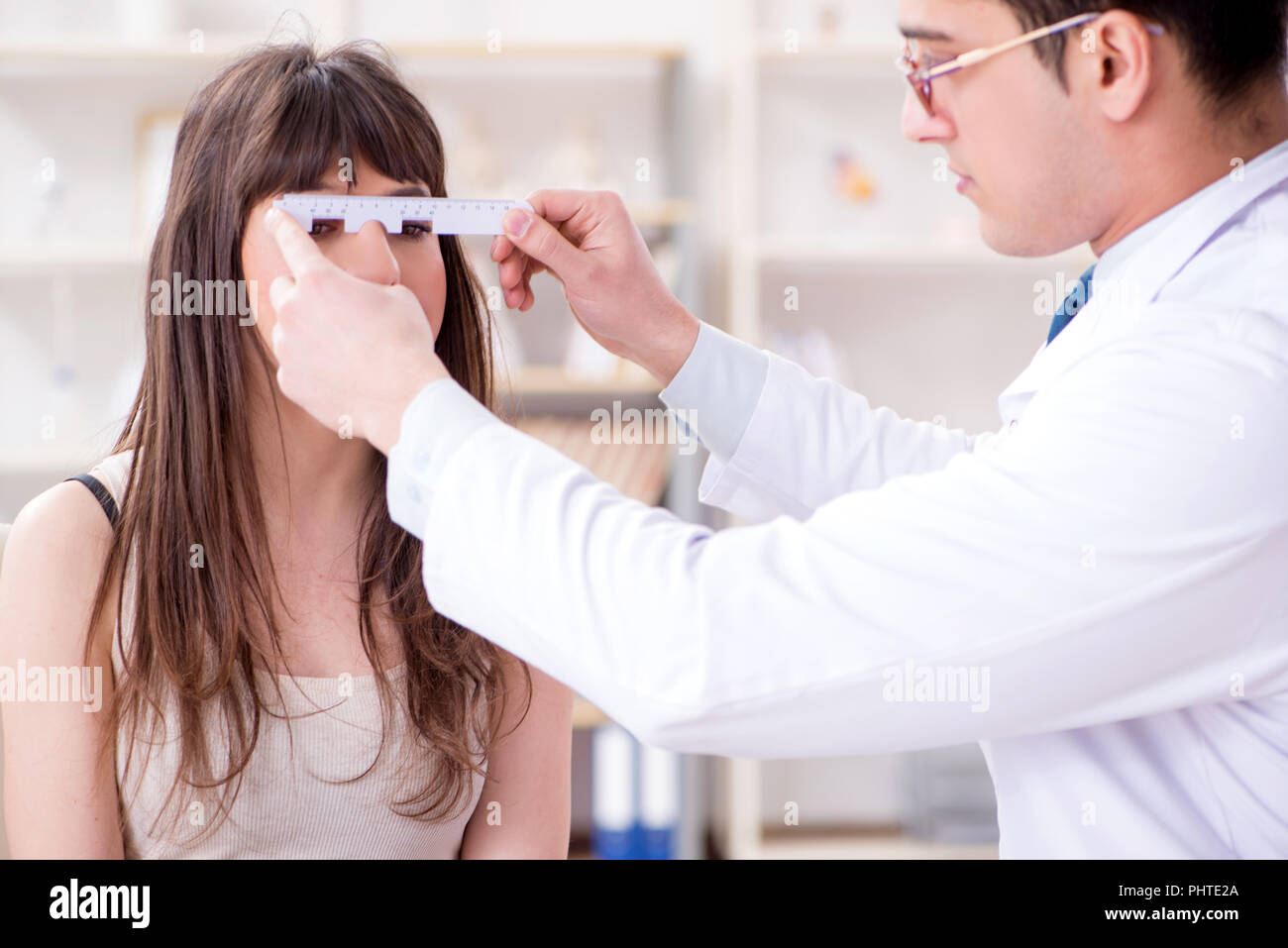 Ophthalmologist is checking up patient in eye doctor hospital Stock ...