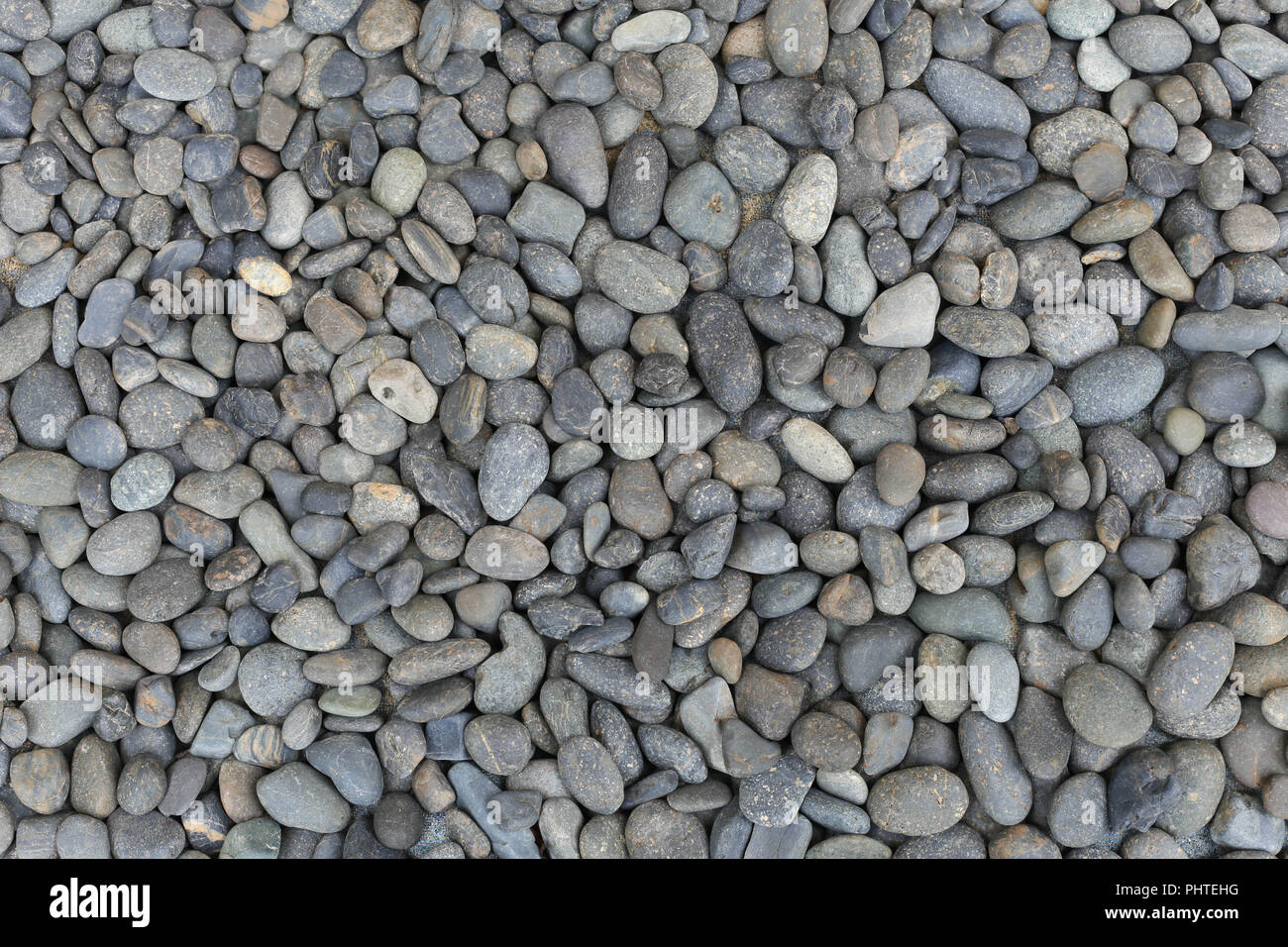 Smooth river pebble stone Stock Photo - Alamy