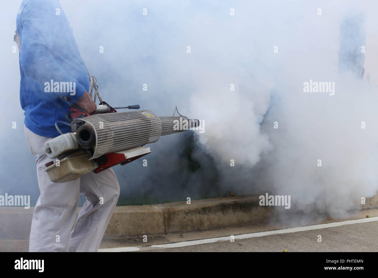 Fogging mosquito to prevent of dengue fever Stock Photo - Alamy
