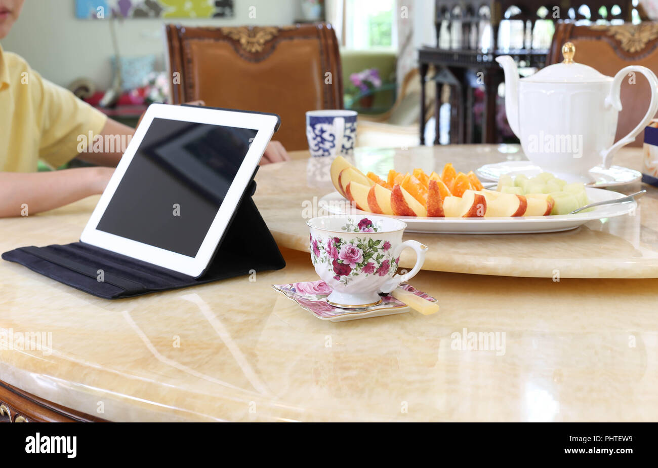 Still life with teapot cup and fruit hi-res stock photography and ...