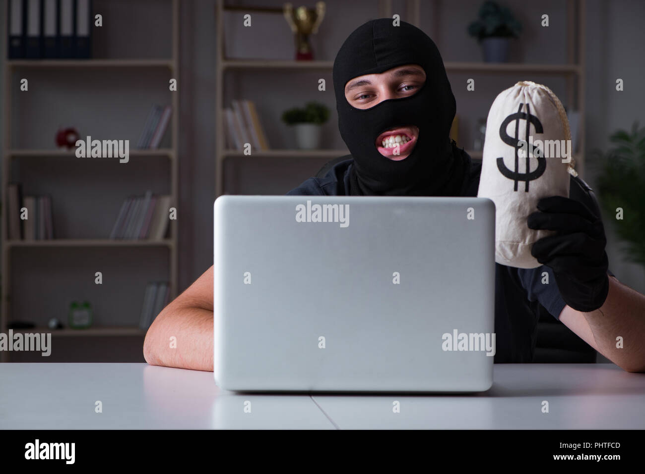 Hacker hacking computer late at night Stock Photo - Alamy