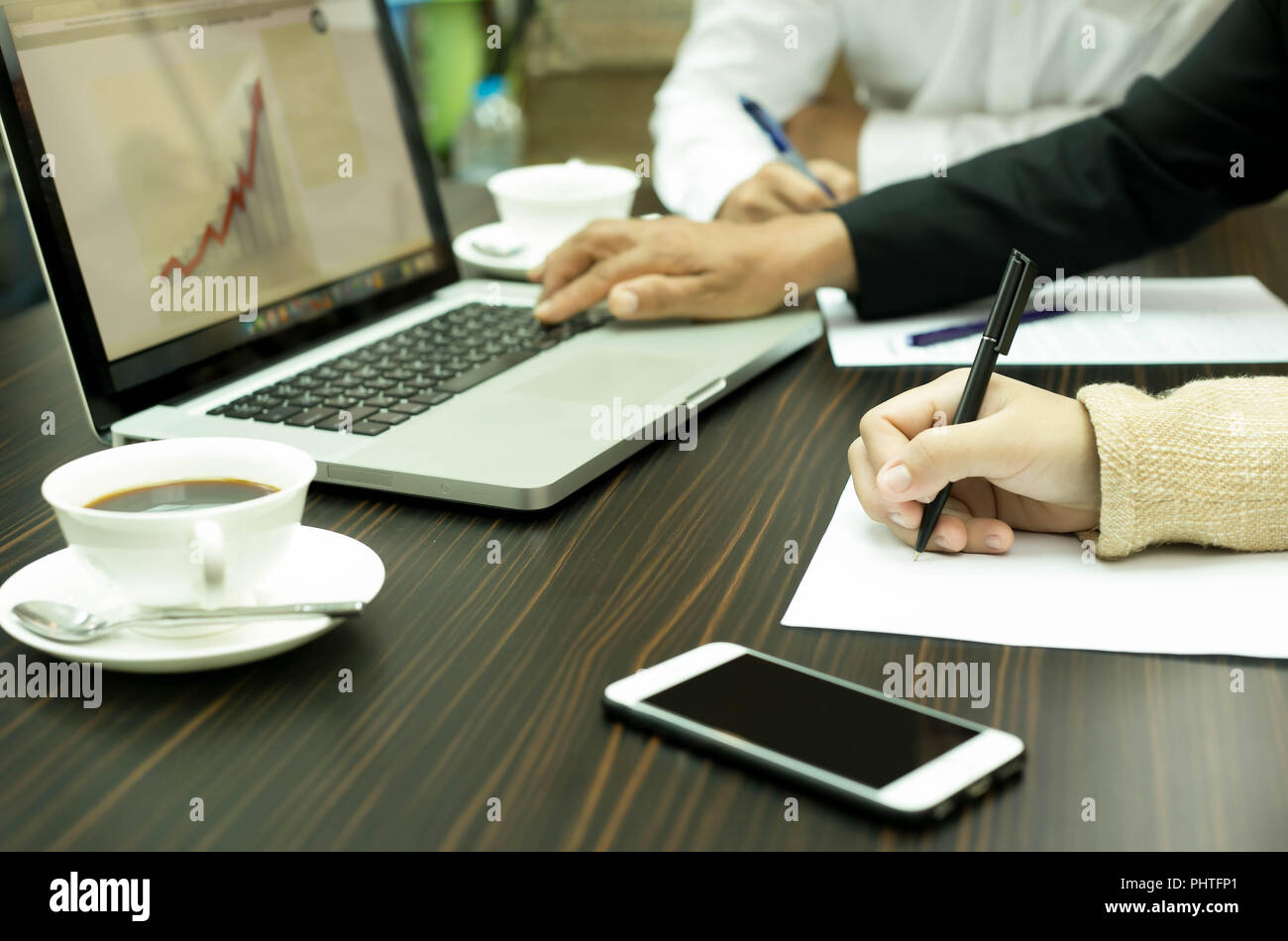Business people Meeting and using notebook computer Stock Photo - Alamy
