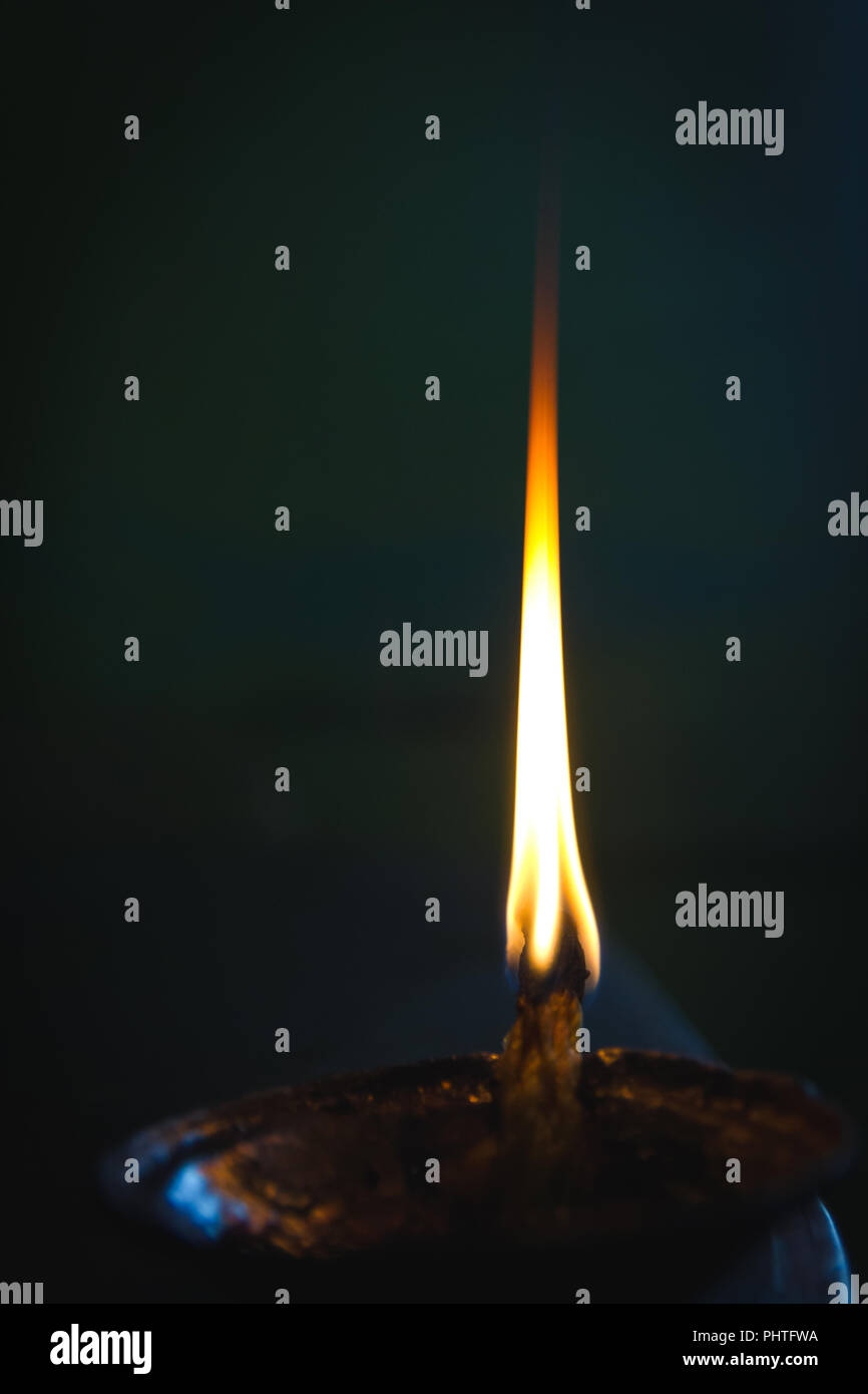 Fire Flames from oil lamps burning in the Temple Stock Photo - Alamy