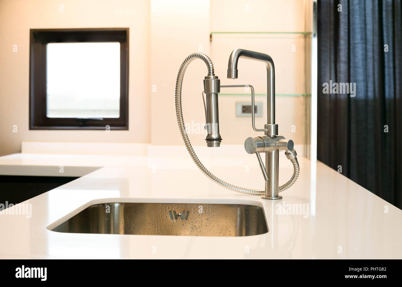 Metal modern design faucet or water tap Stock Photo - Alamy
