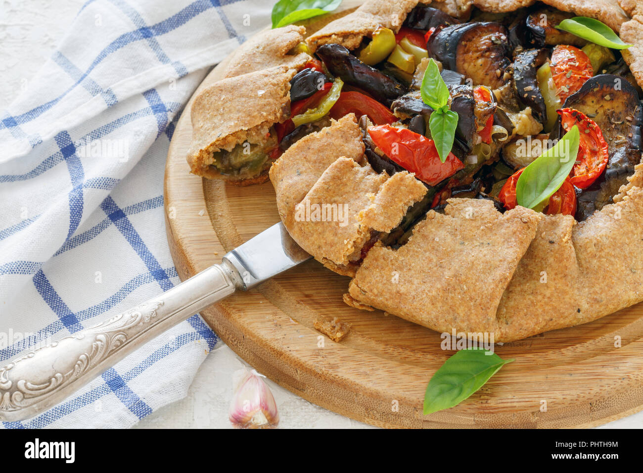 Cut free-form pie with vegetables Stock Photo - Alamy