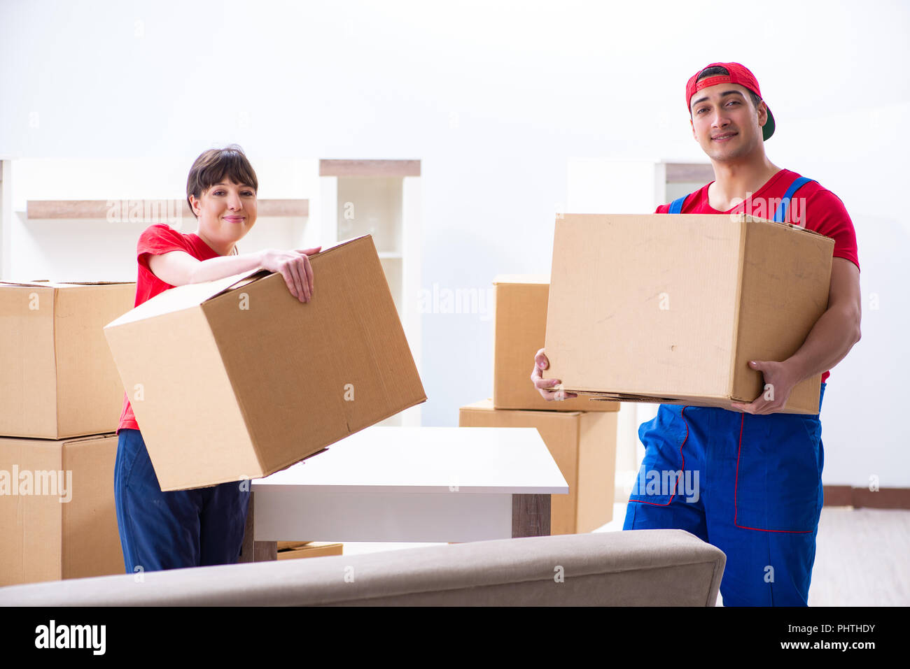 Professional movers doing home relocation Stock Photo - Alamy