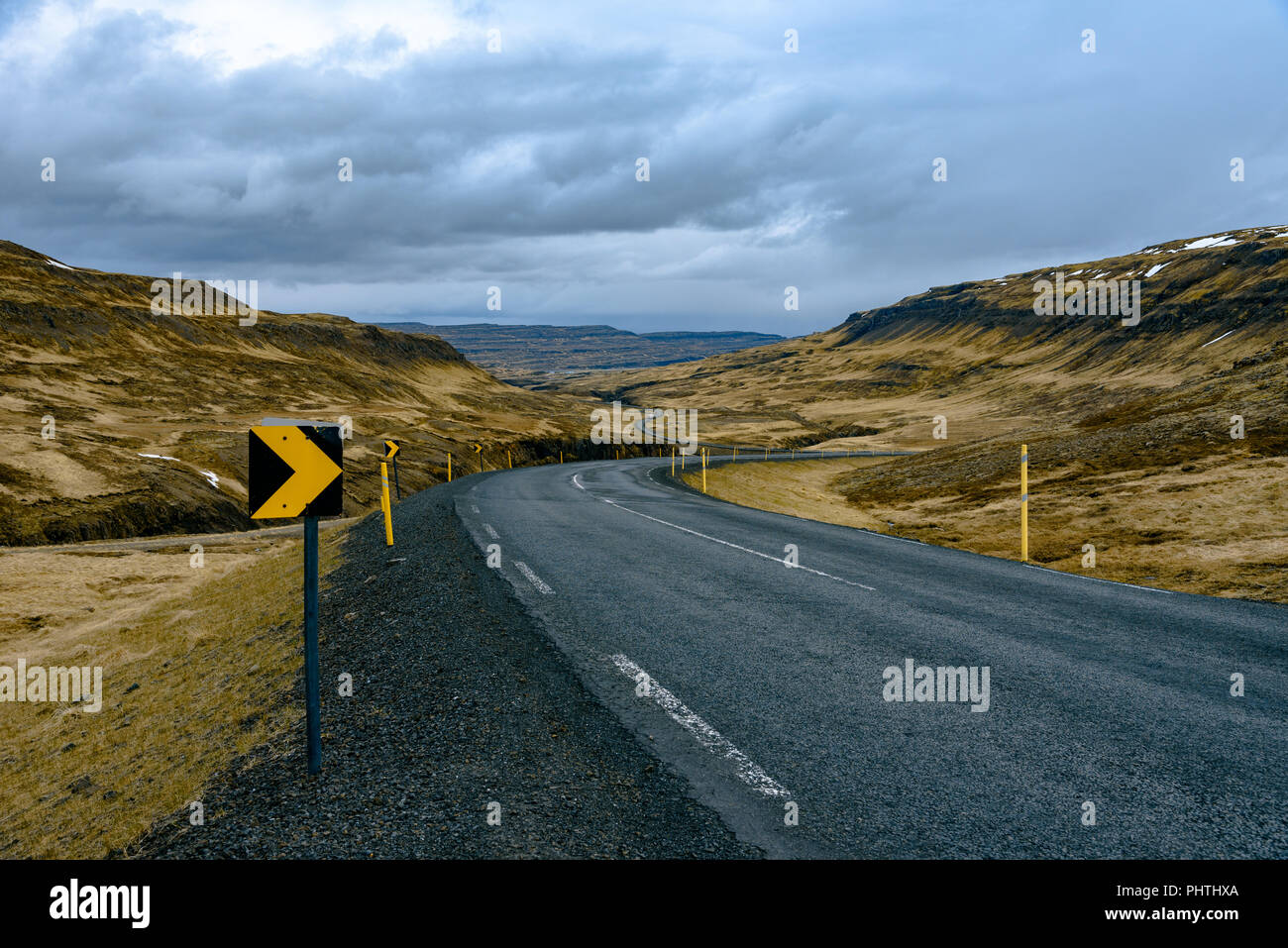 The winding Vestfjardavegur route 60 in western Iceland on a stormy day ...