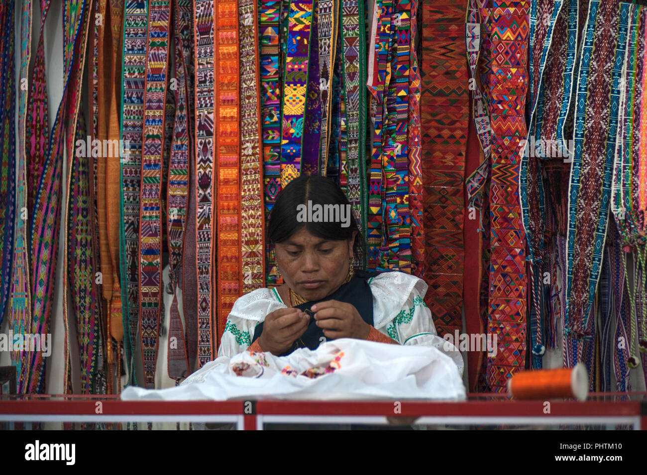 Otavalo, Ecuador - July 5, 2012: Indian women in national clothes sells ...