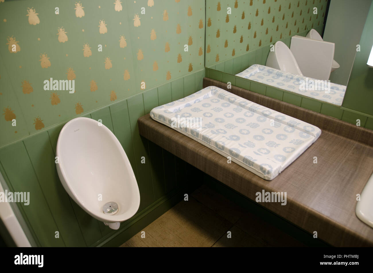 Baby changing mat in a mens toilet Stock Photo - Alamy