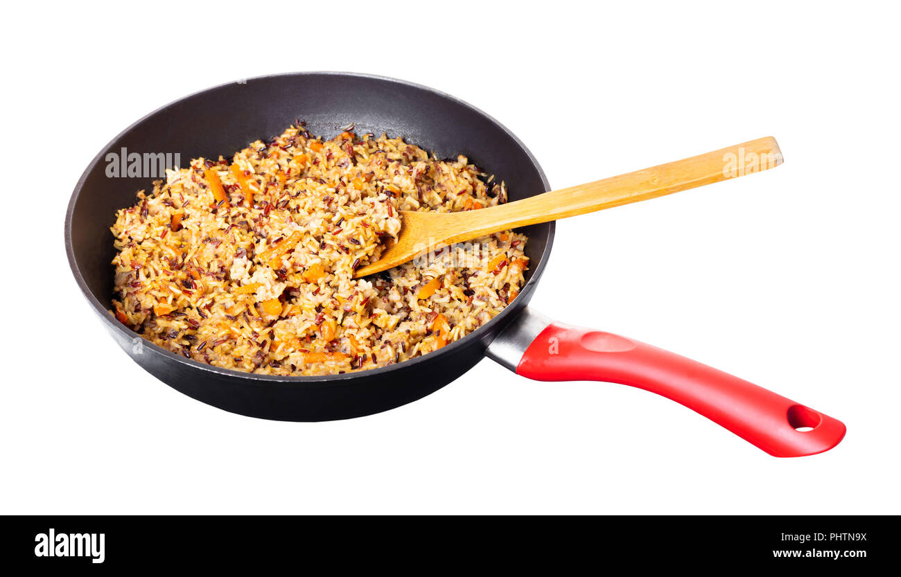 assorted cooked rice with vegetables in a frying pan on white isolated ...