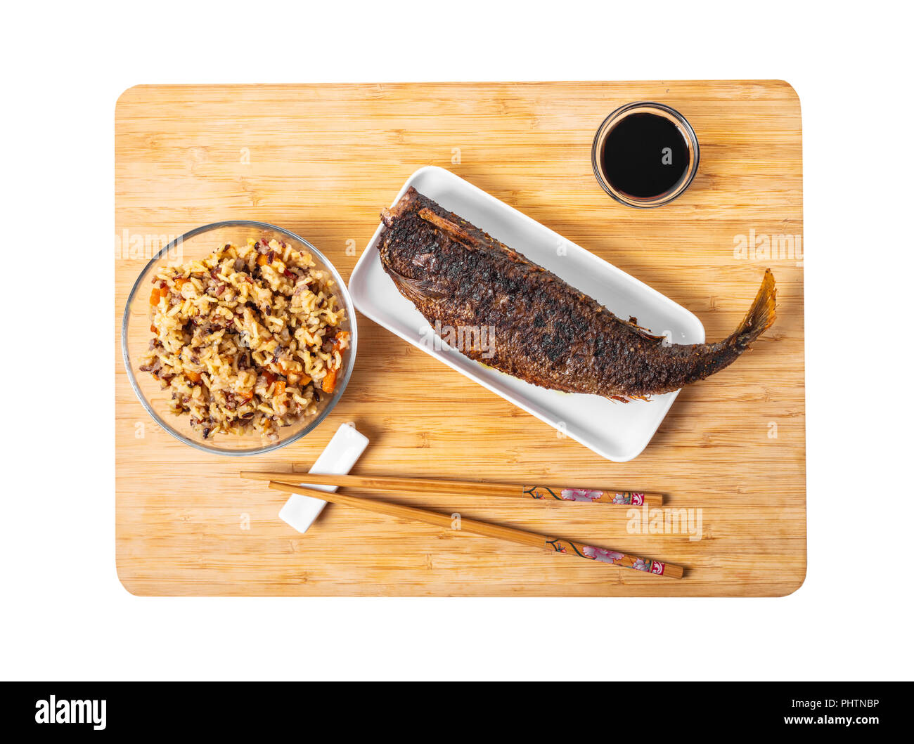 cooked fish with rice on white isolated background Stock Photo - Alamy