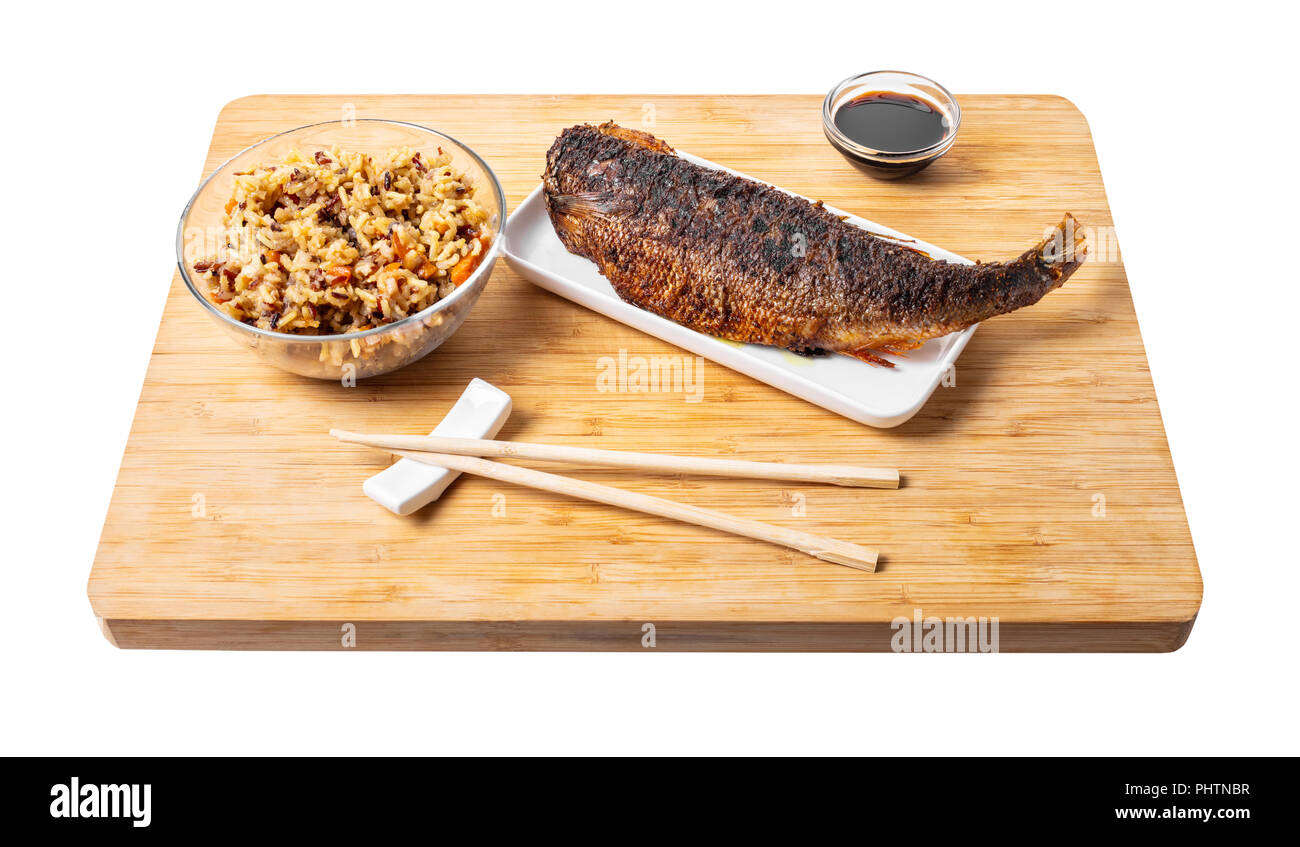 cooked fish with rice on white isolated background Stock Photo - Alamy