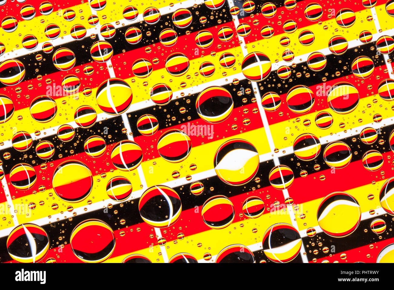 Flags of Germany, behind a glass covered with rain drops.Pattern from ...