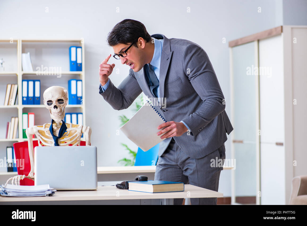 Angry boss yelling at his skeleton employee Stock Photo - Alamy