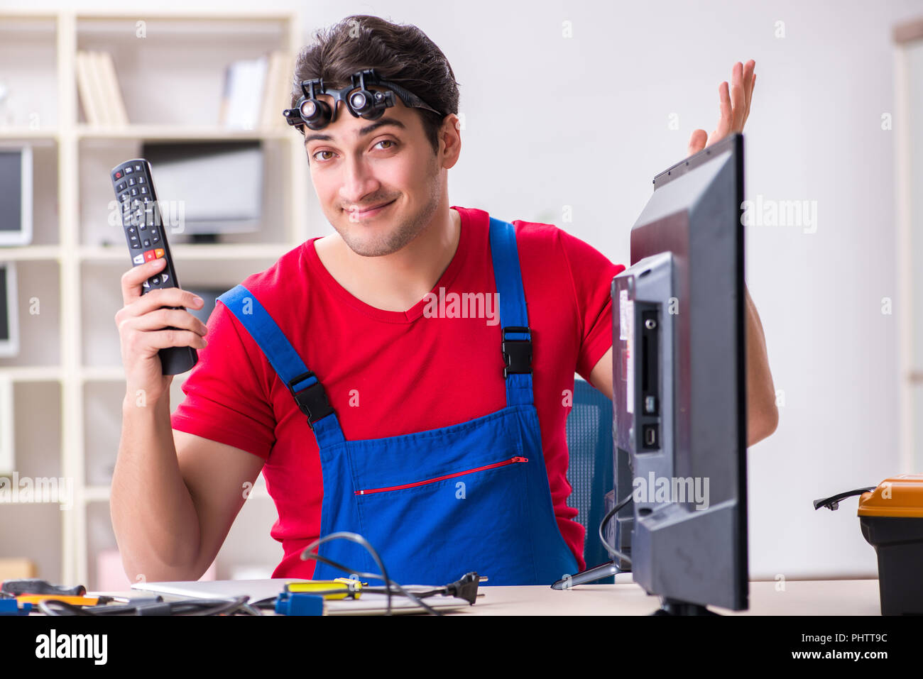 Professional repair engineer repairing broken tv Stock Photo - Alamy