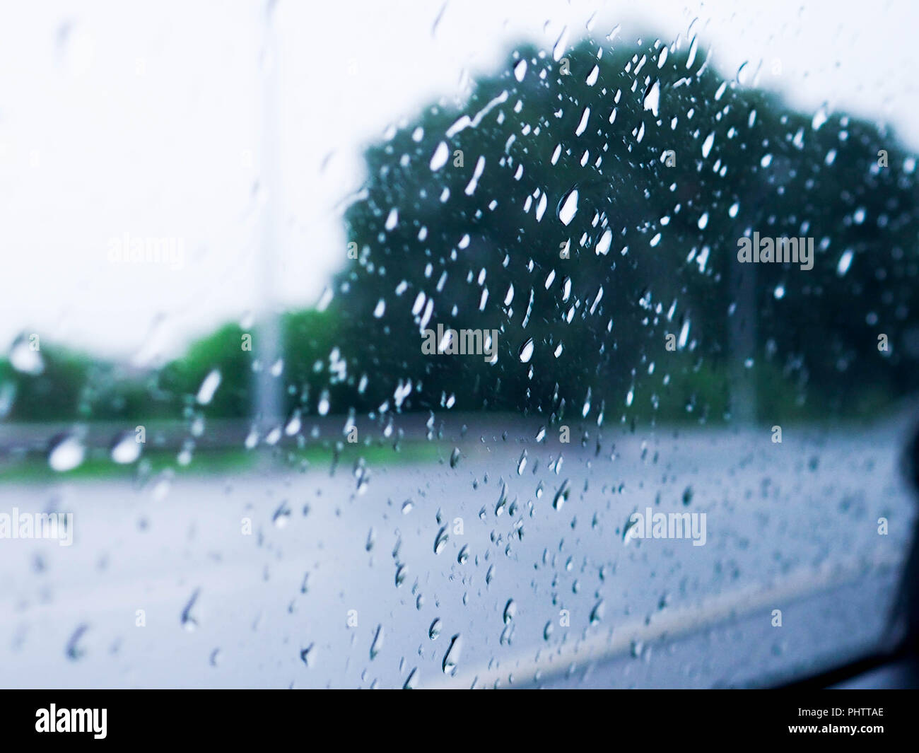 Water drop on the glass of windows background, raining on the glass off ...
