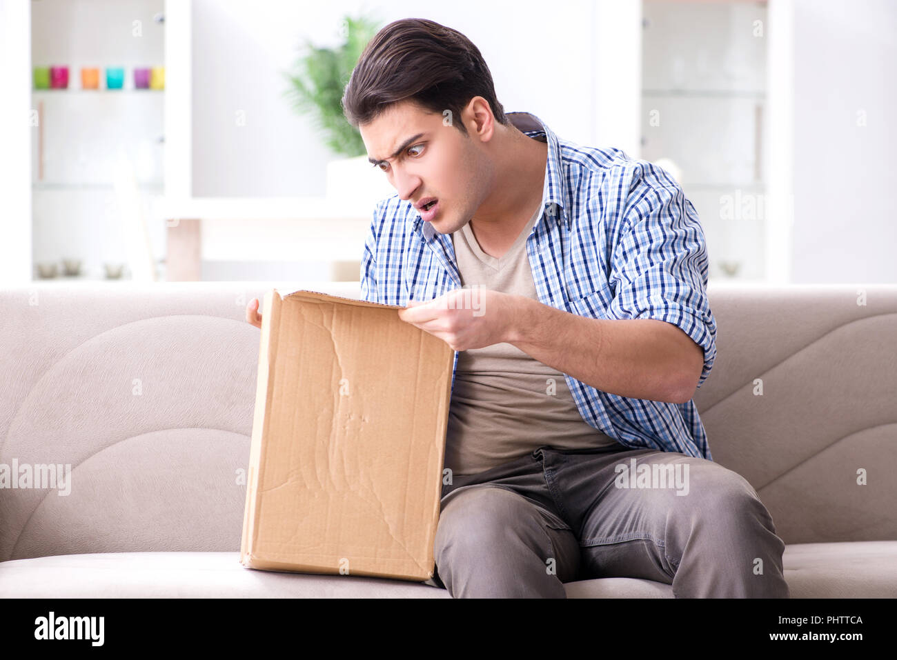 Man receiving empty parcel with stolen goods Stock Photo - Alamy