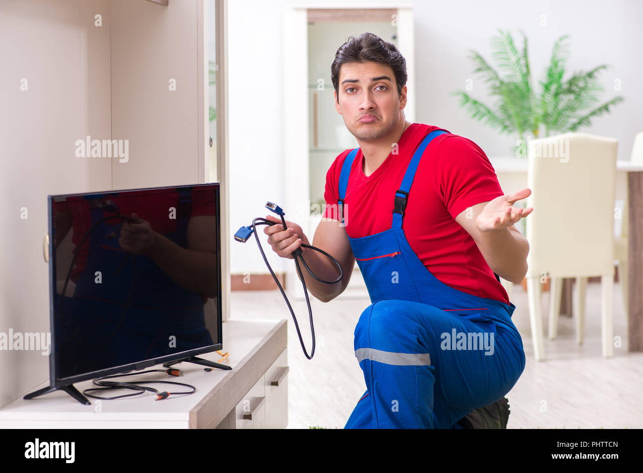 Professional repair engineer repairing broken tv Stock Photo - Alamy