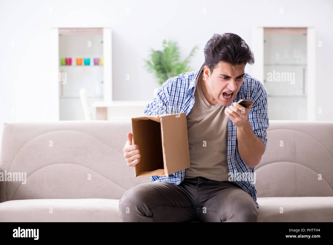 Man receiving empty parcel with stolen goods Stock Photo - Alamy