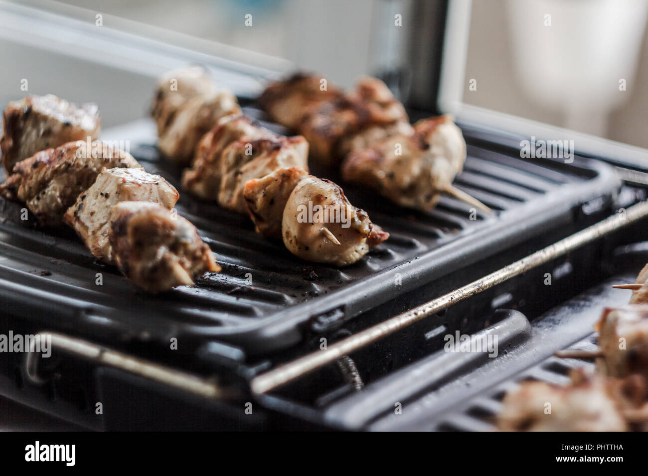 Pork-beef shish kebab prepared on a home electric grill Stock Photo - Alamy