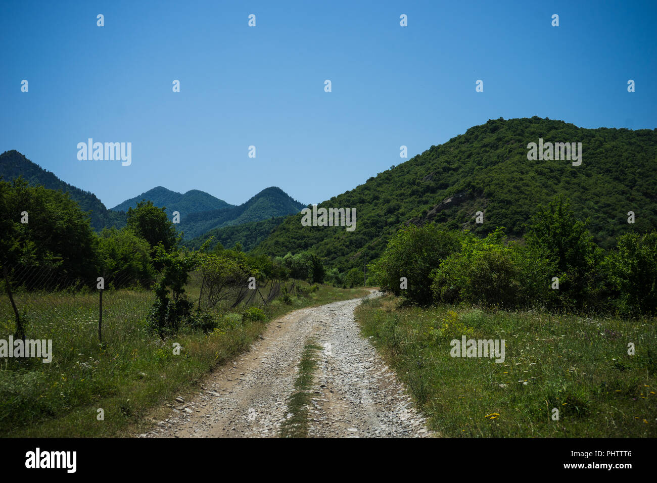 Rural landscape with road in a hills somewhere in Georgia, Caucasus ...
