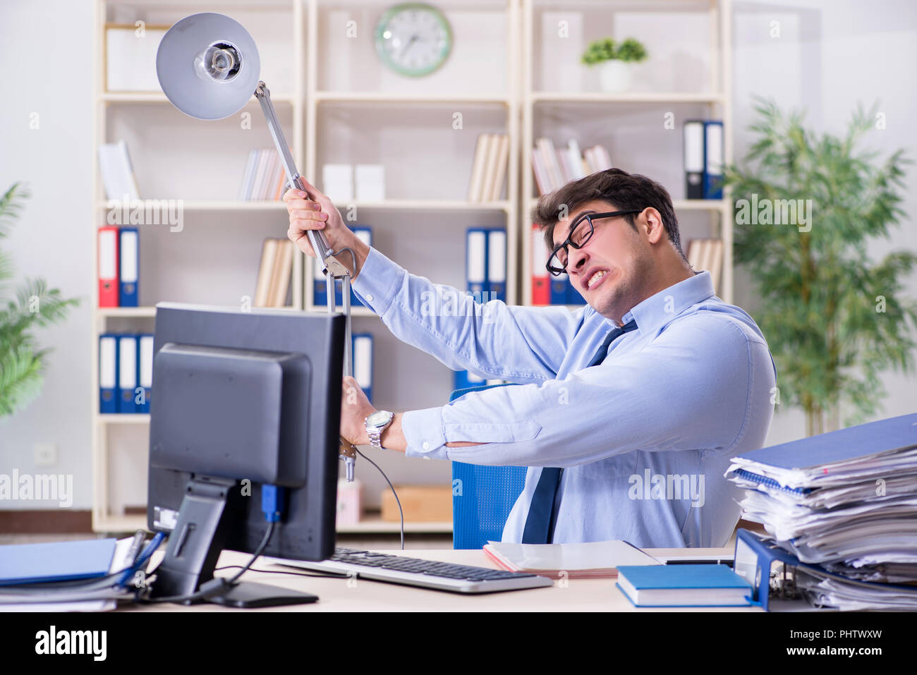 Angry businessman frustrated with too much work Stock Photo - Alamy