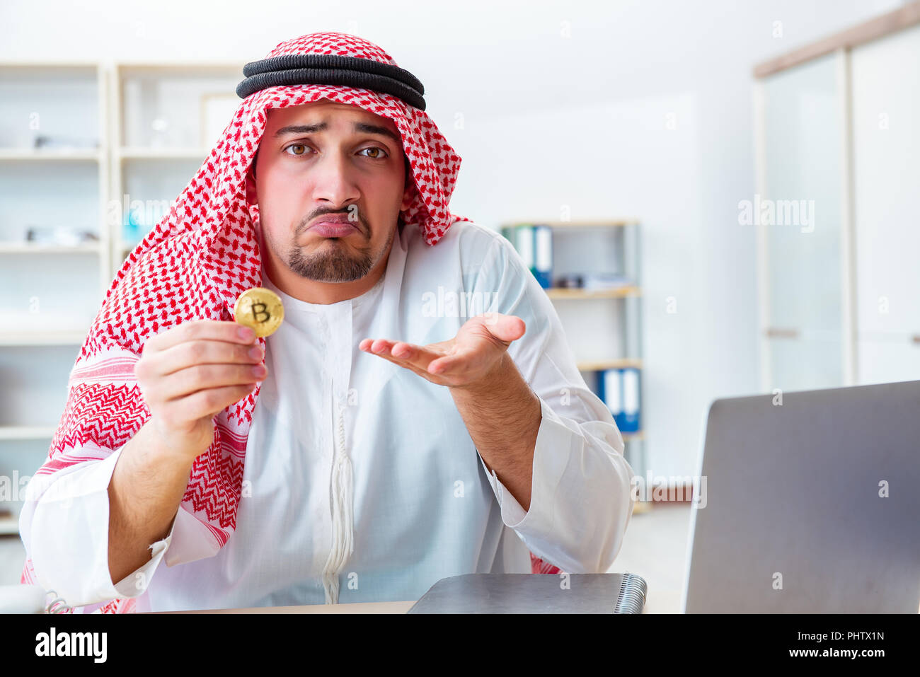 Arab man with bitcoin in cryptocurrency mining concept Stock Photo - Alamy