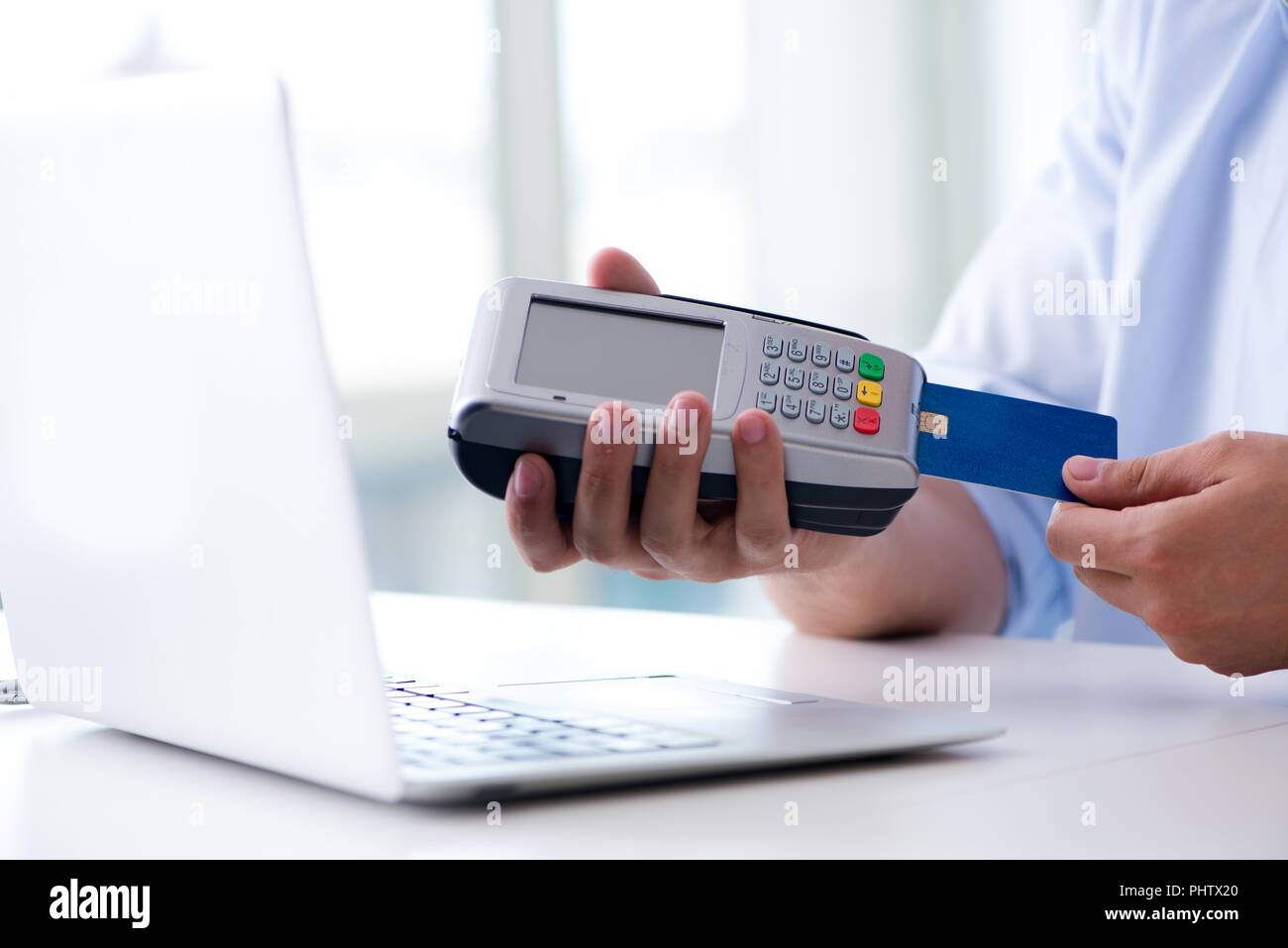 Man processing credit card transaction with POS terminal Stock Photo ...