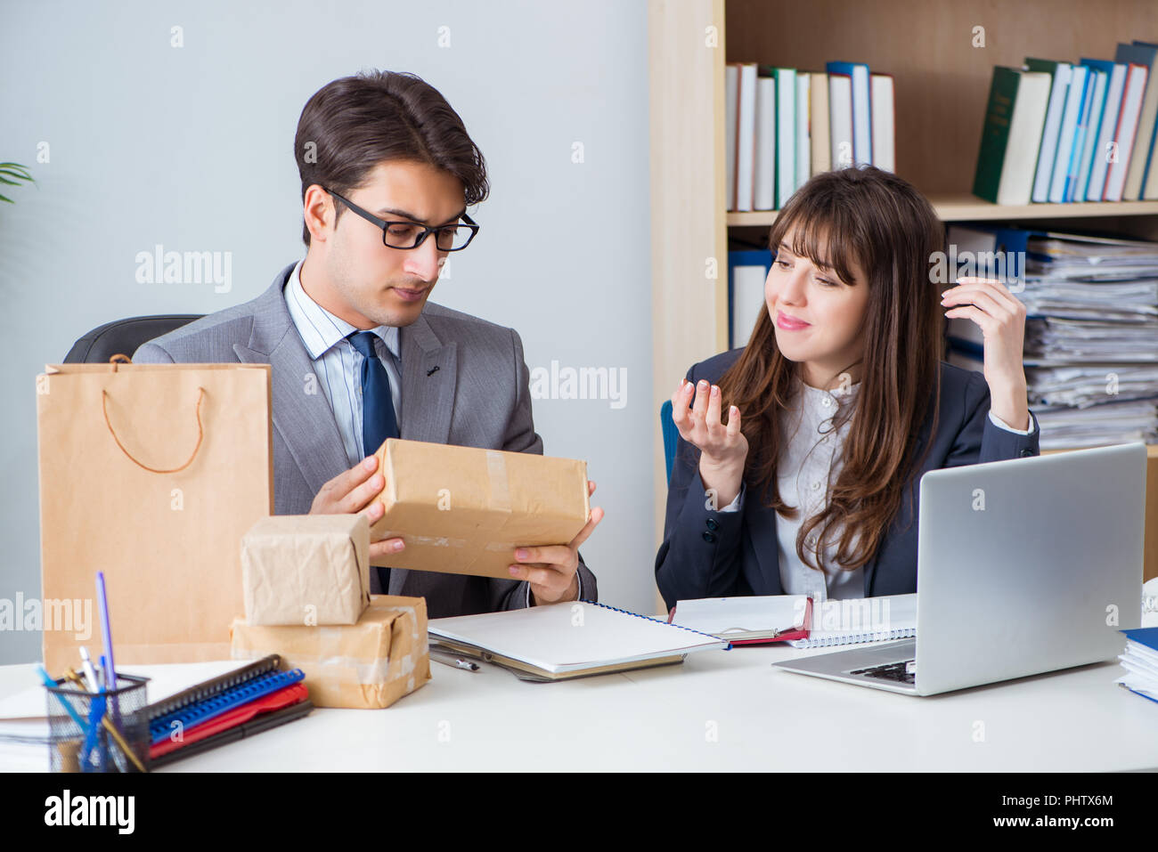 Business people receiving new mail and parcels Stock Photo - Alamy