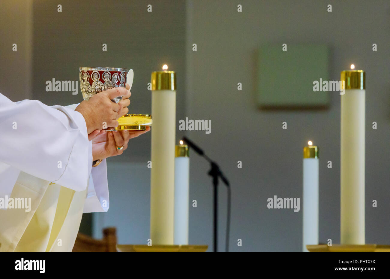 Holy communion cup of glass with red wine, bread and Holy Bible prayer ...