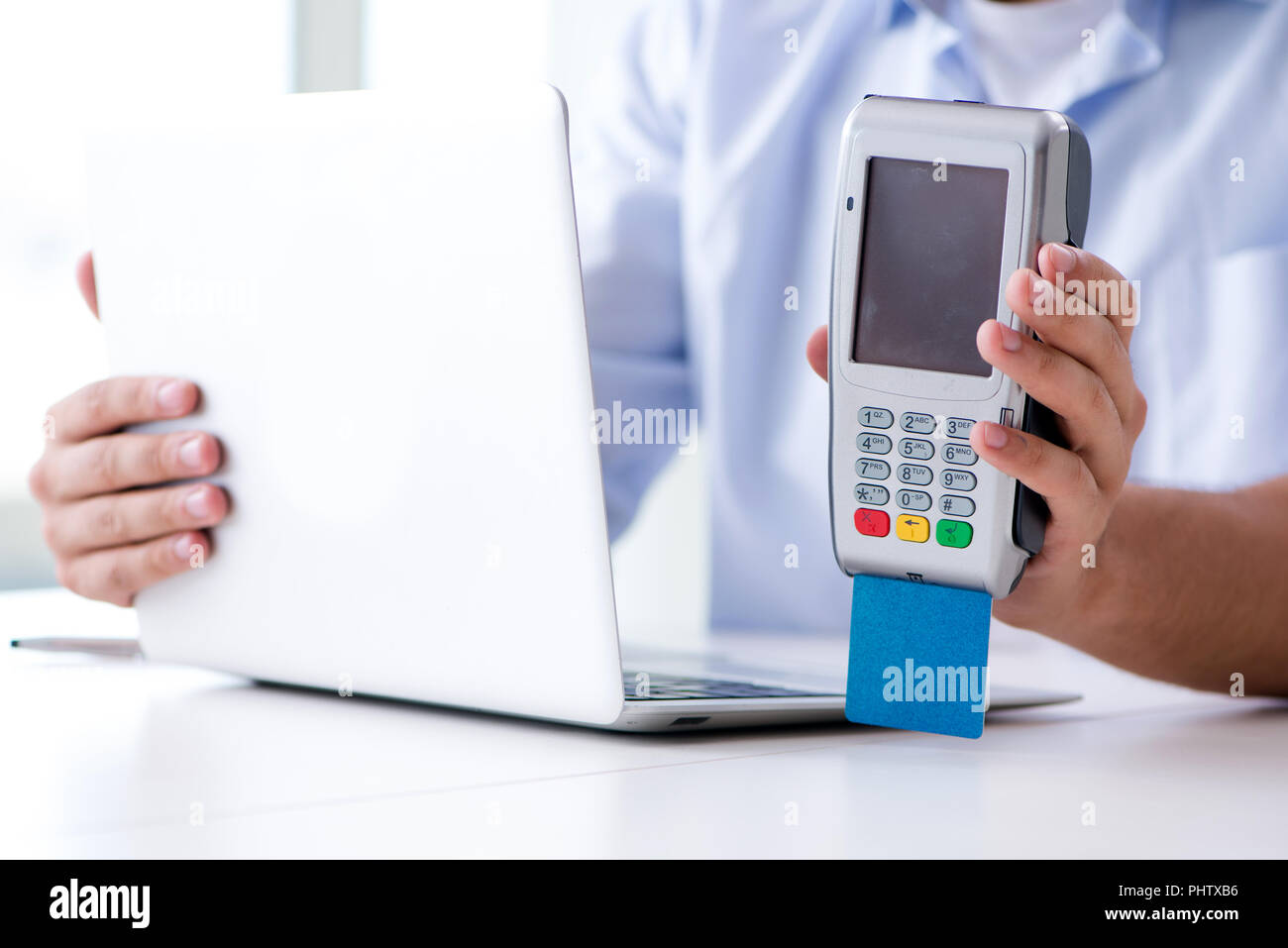 Man processing credit card transaction with POS terminal Stock Photo ...