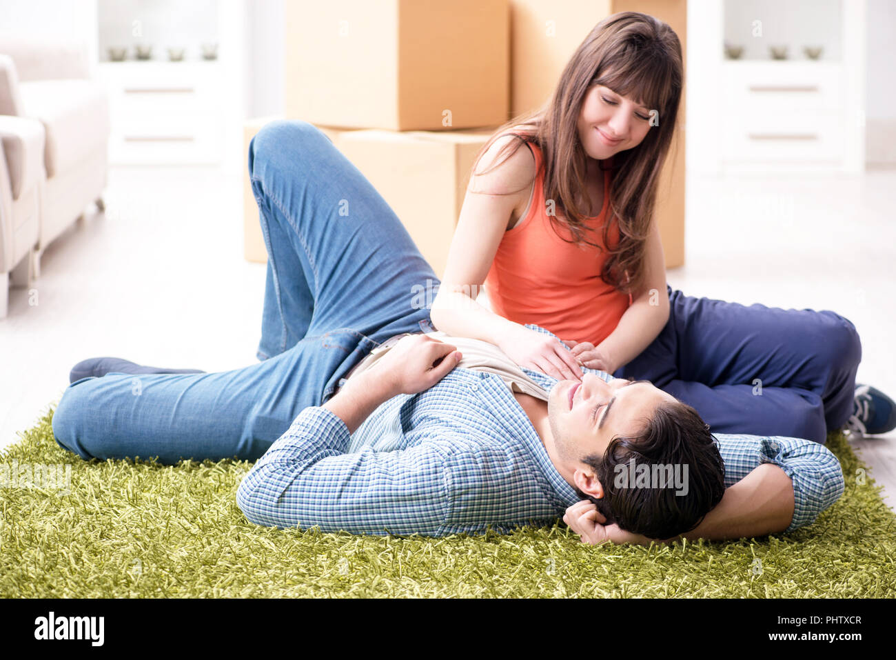 Tired family relaxing moving house hi-res stock photography and images ...